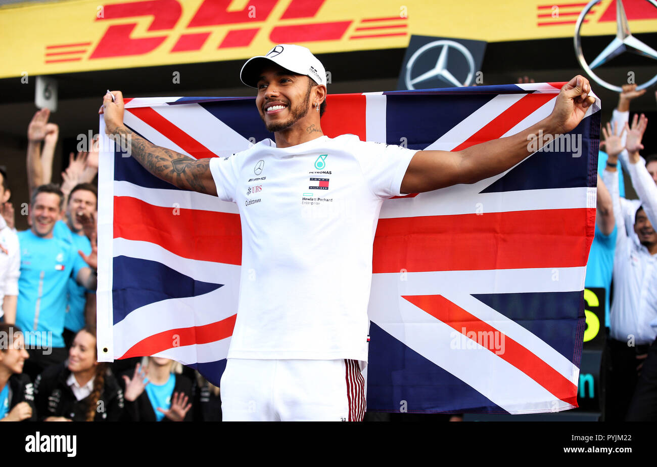 Mercedes' Lewis Hamilton celebrates winning the Formula One drivers ...