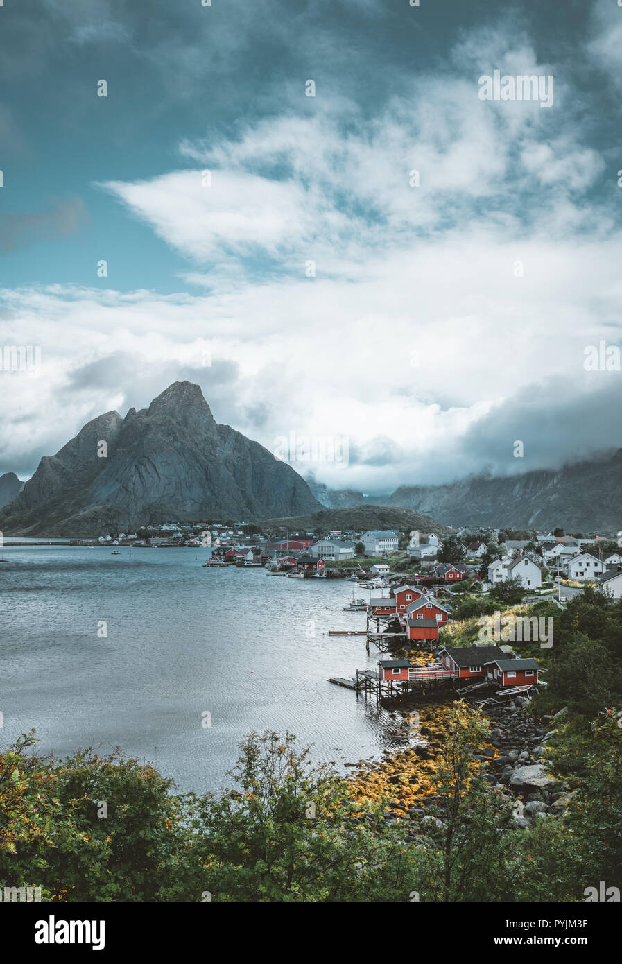 Landscape of fishing village Reine with the Reine Fjord during sunset ...
