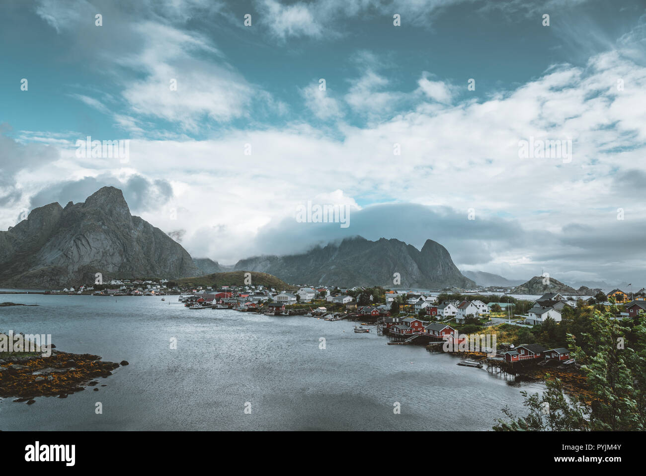 Landscape of fishing village Reine with the Reine Fjord during sunset ...