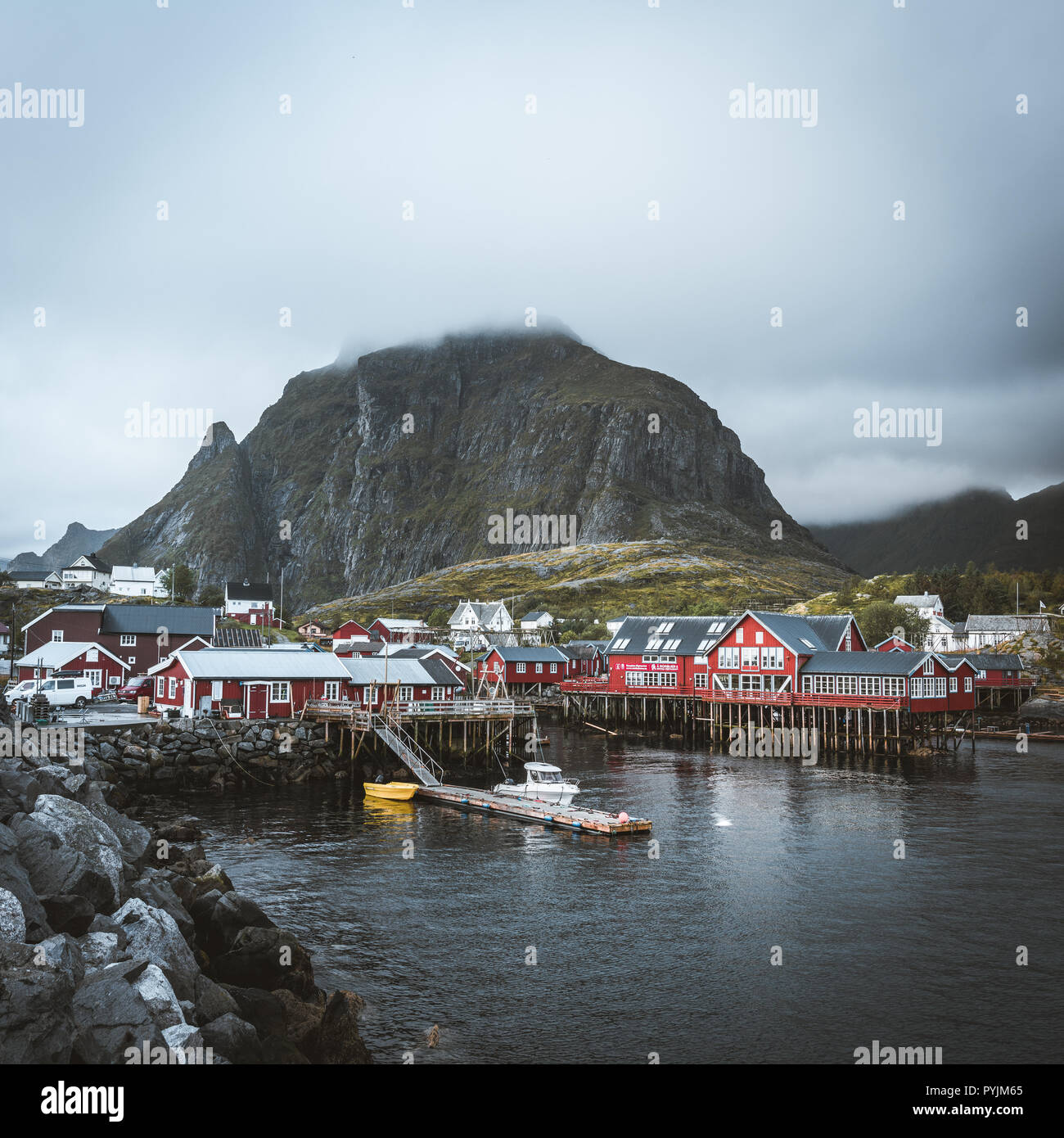 Landscape of fishing village Reine with the Reine Fjord during sunset ...