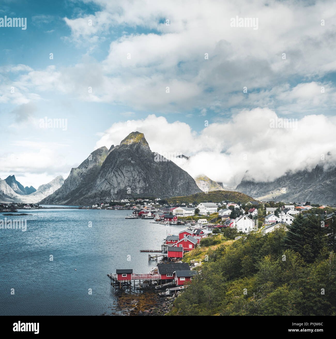 Landscape of fishing village Reine with the Reine Fjord during sunset ...