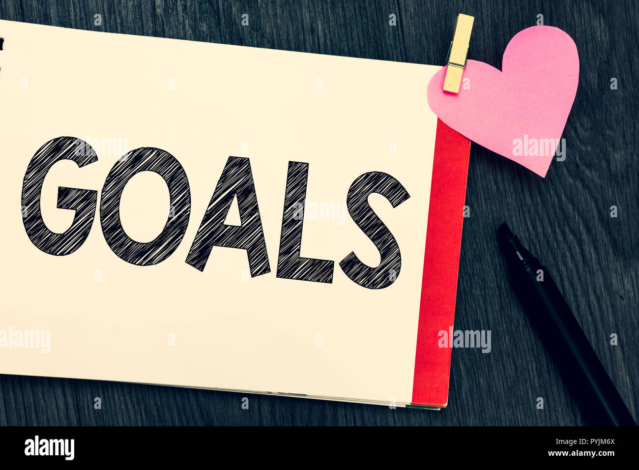 Writing note showing Goals. Business photo showcasing persons ambition ...