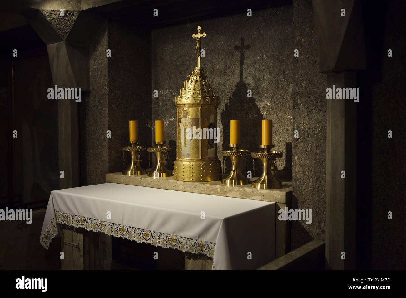 Tabernacle and candelabras on the altar in the underground crypt in the ...