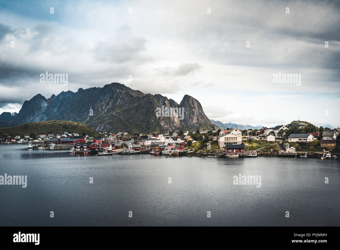 Landscape of fishing village Reine with the Reine Fjord during sunset ...