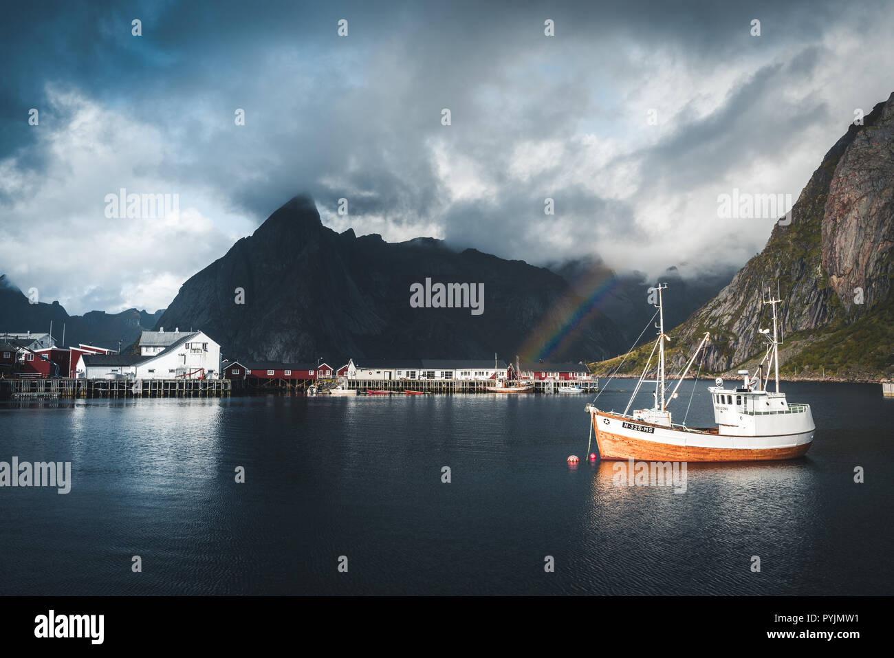 Reine, September 2018: Ship with rainbow in the background in the ...