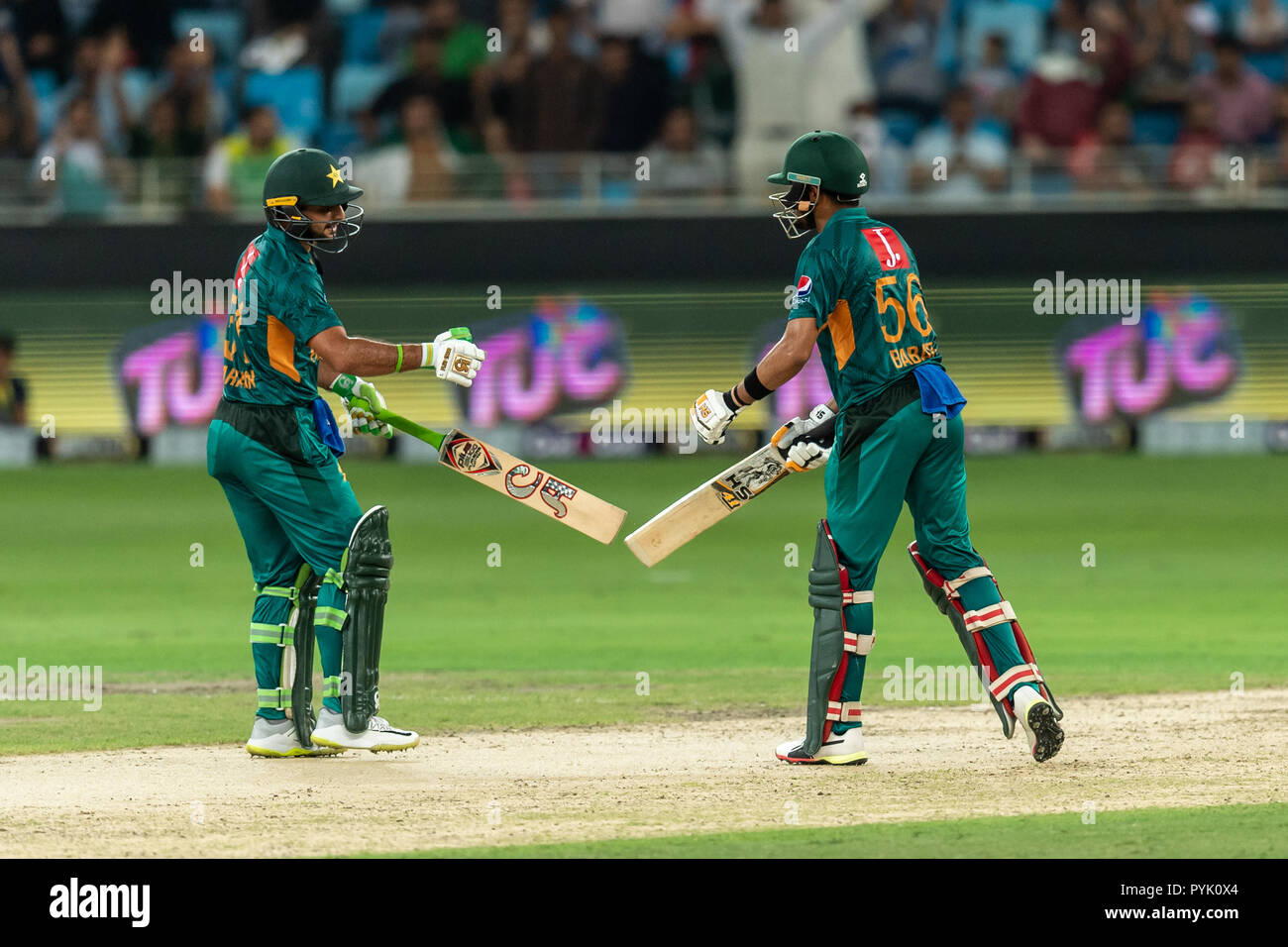 Dubai, UAE. 28th Oct, 2018. Sahibzada Farhan ( left) congratulates ...