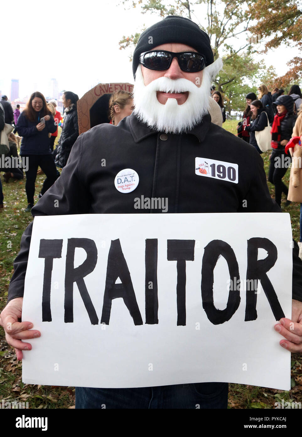 New York City, New York, USA. 28th Oct, 2018. A dog owner holds a ...