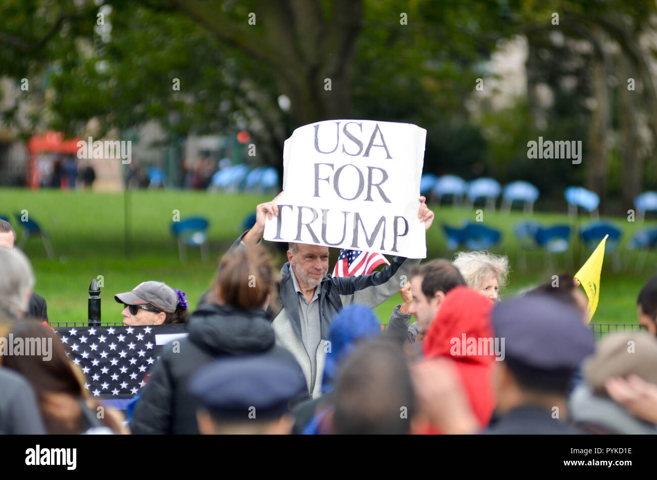 A demonstrator seen holding a pro Trump placard. Hundreds of counter ...