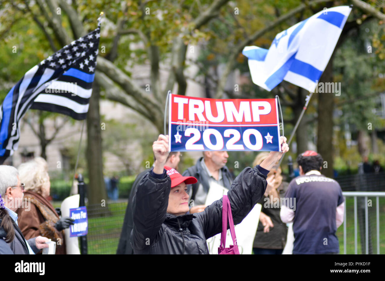 A demonstrator seen holding a pro Trump placard. Hundreds of counter ...