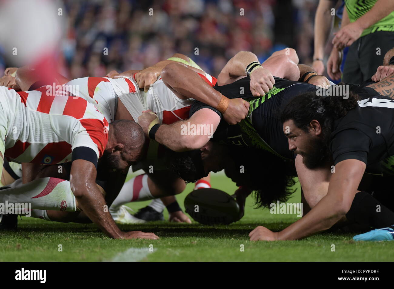 Players of Japan and World XV compete in a scrum during the Rugby ...