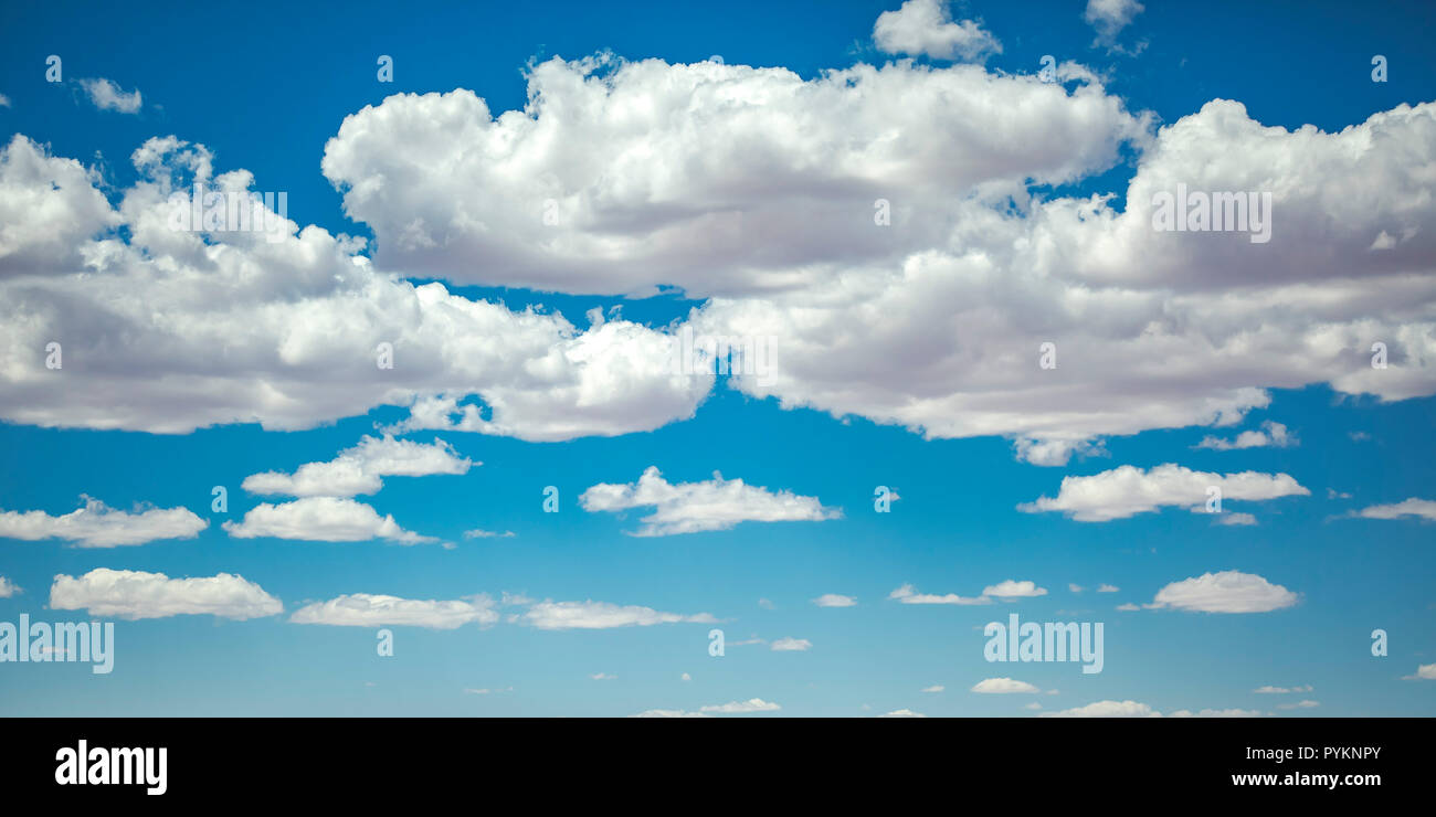 Bright blue sky with puffy clouds over Moab Utah Stock Photo - Alamy