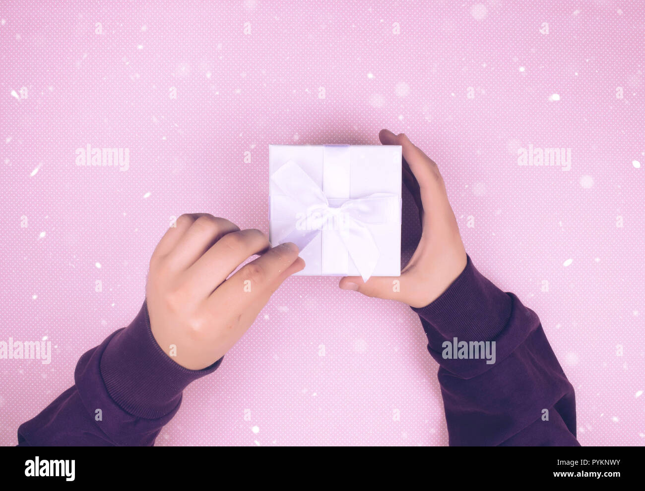 Hands holding a small box with a gift Stock Photo - Alamy