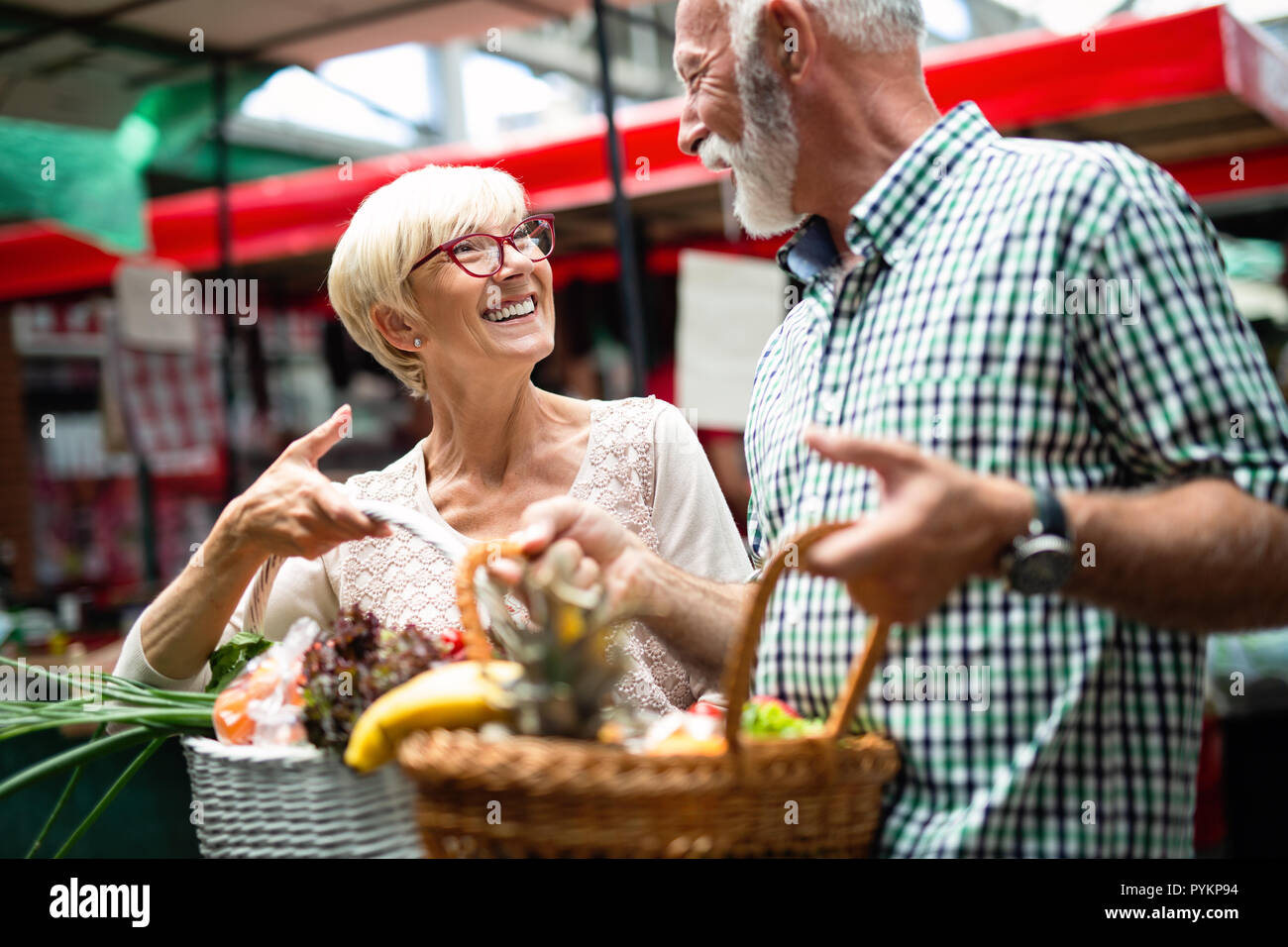 Senior shopping couple with basket on the market. Healthy diet Stock ...