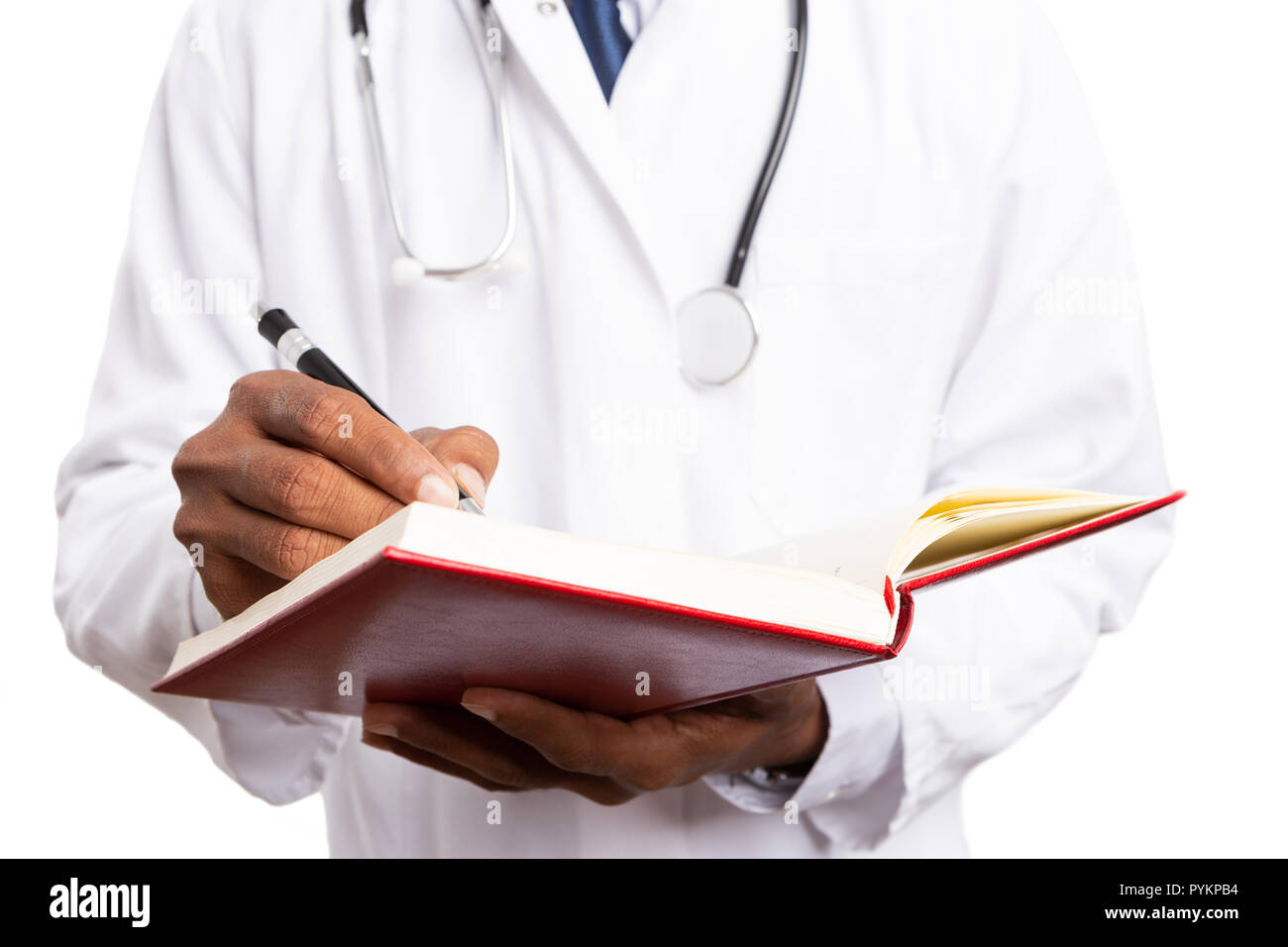 Close-up of doctor using pen to write in notebook isolated on white ...