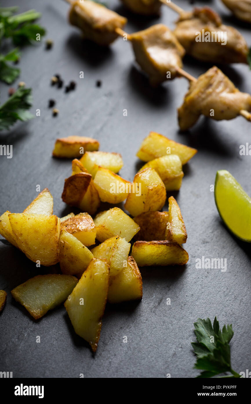 Chicken kebab on the black stone background. Selective focus Stock ...