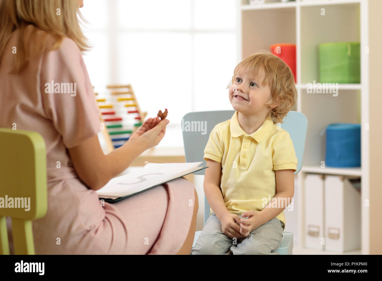 Cute little child boy at speech therapist office Stock Photo - Alamy