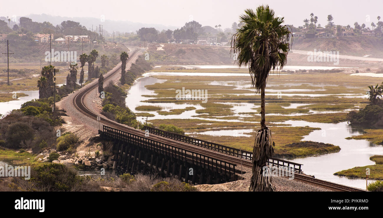 Train track and bridge over a lagoon in Carlsbad Stock Photo - Alamy