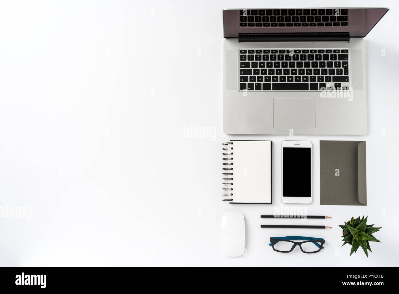 Office desktop with laptop and accessories. Top view Stock Photo - Alamy