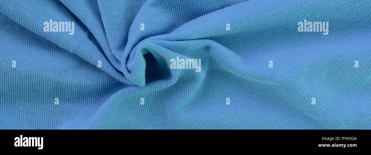 The texture of the fabric in blue color. Material for making shirts and ...