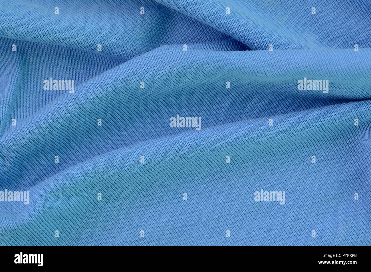 The texture of the fabric in blue color. Material for making shirts and ...