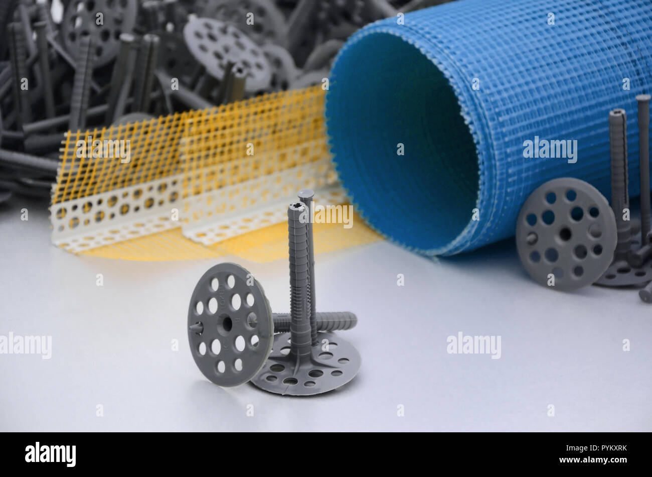 A set of construction items for the insulation of walls. Plastic dowels ...