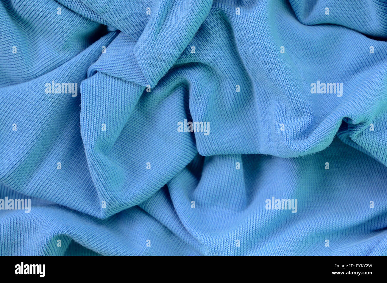 The texture of the fabric in blue color. Material for making shirts and ...