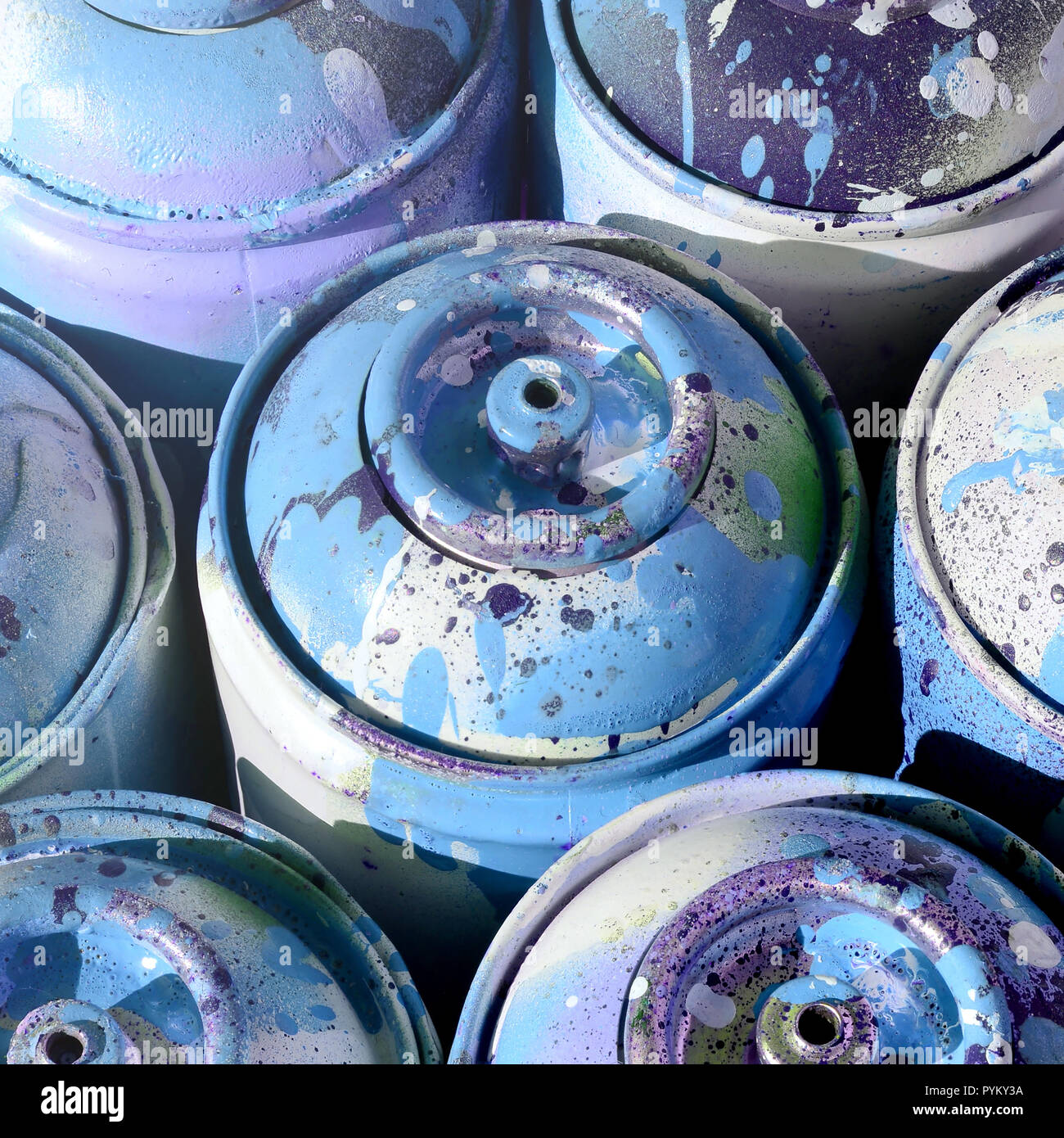 A lot of used blue metal tanks with paint for drawing graffiti Stock ...