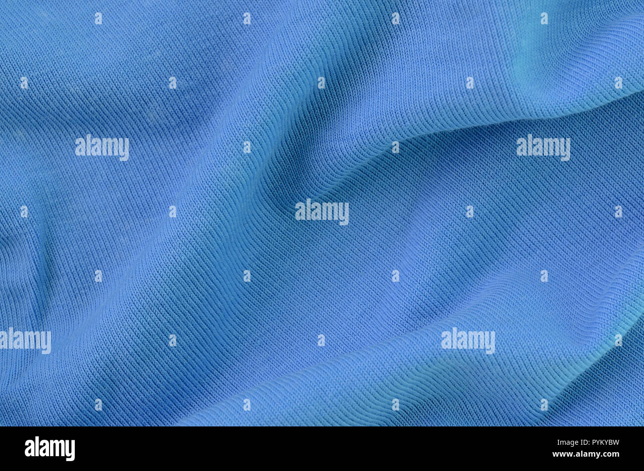 The texture of the fabric in blue color. Material for making shirts and ...