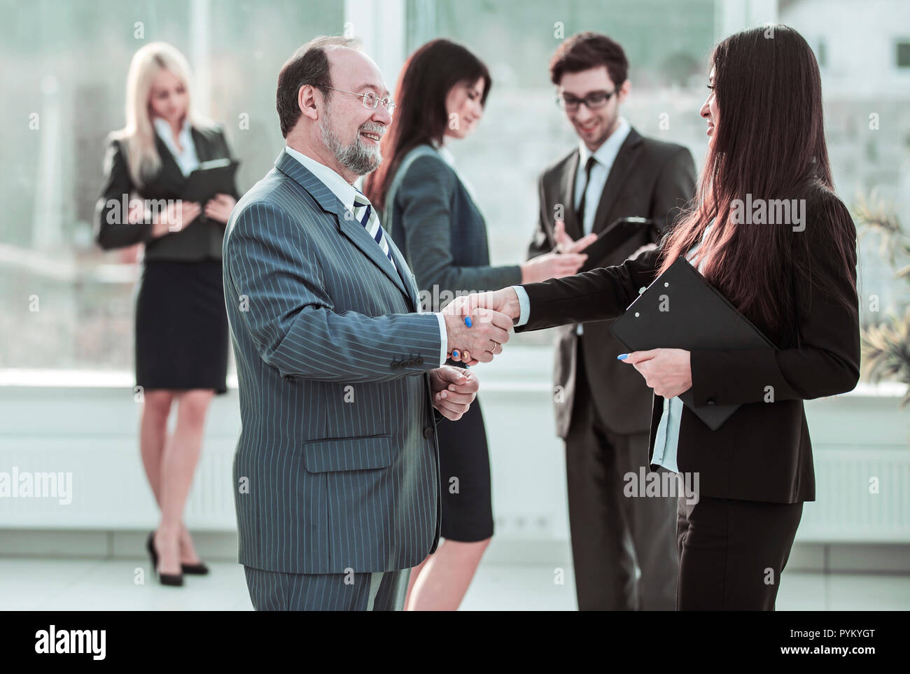 welcome handshake between lawyer and client on the background of ...