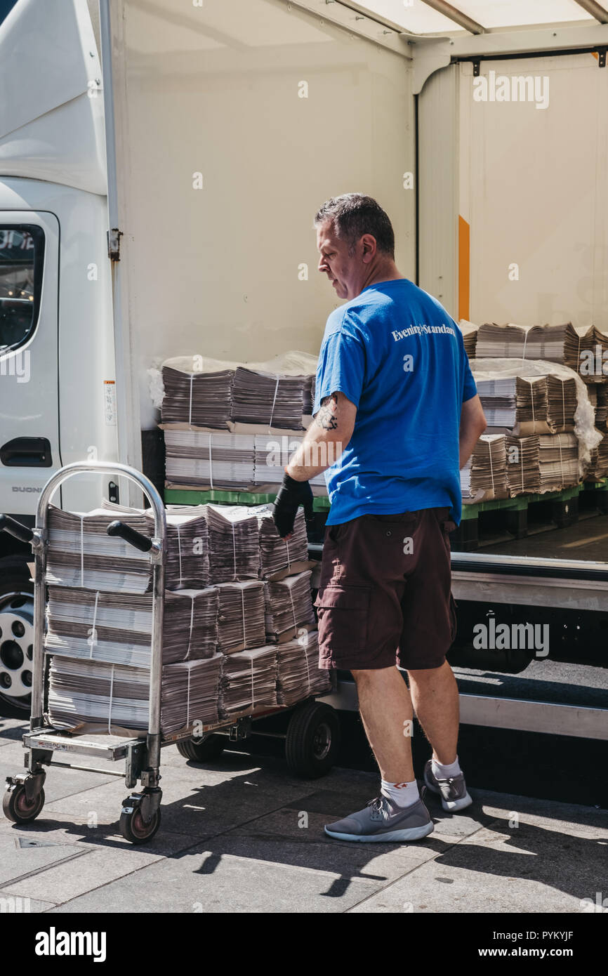 London, UK - August 1, 2018: Man unloading Evening Standard newspaper ...
