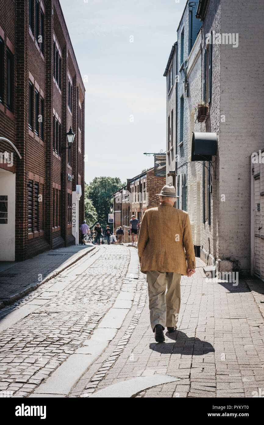 London, UK - August 1, 2018. Rear view of a senior man walking on a ...