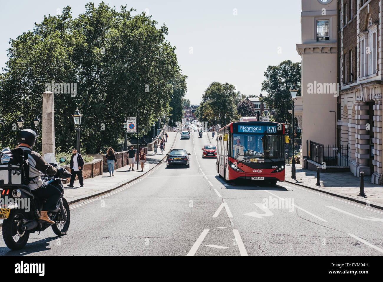 Red bus on route R70 bus on the street in Richmond, a suburban town on ...