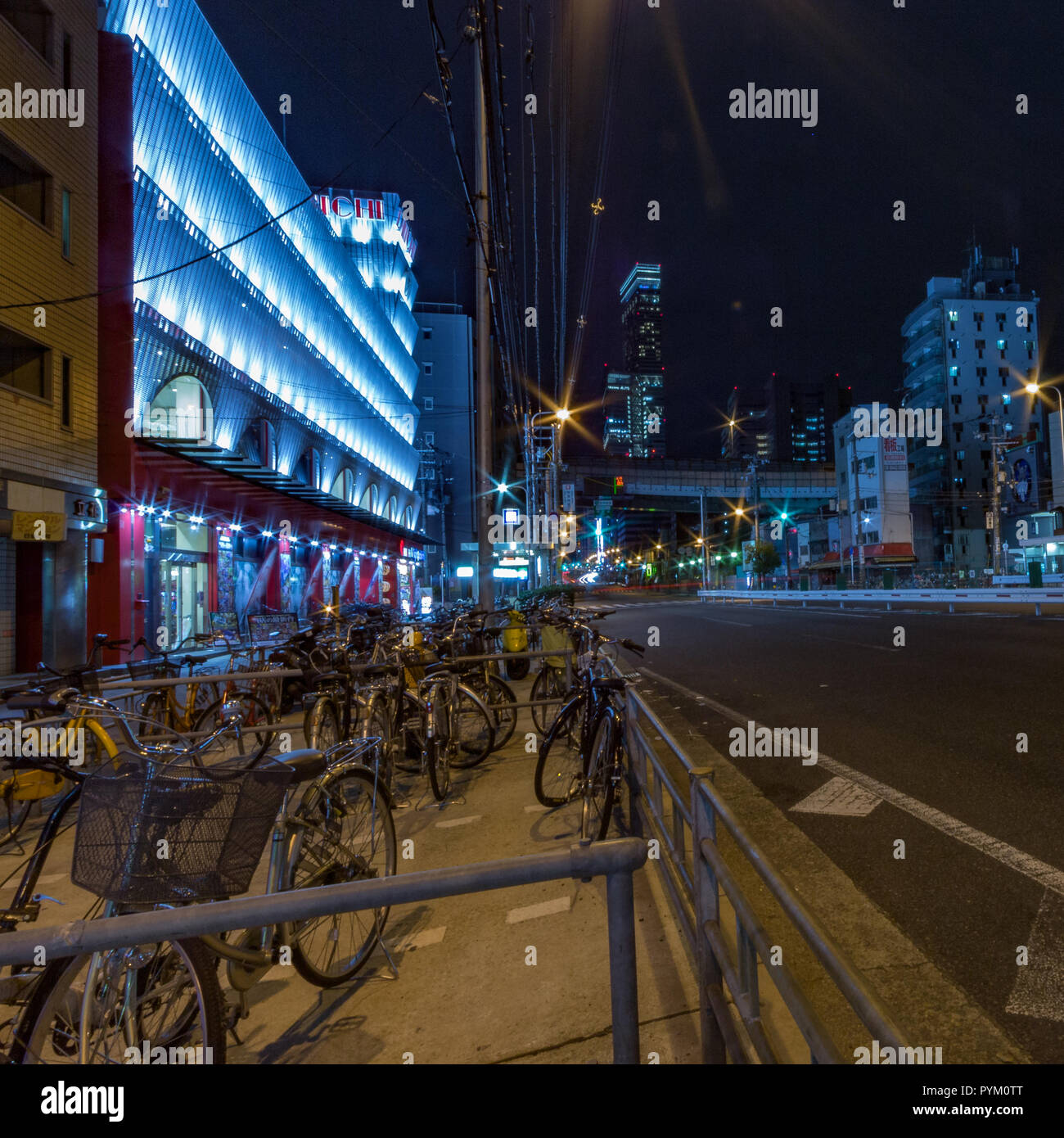 Night view of bicycles and urban street, Tennoji, Osaka, Japan Stock ...