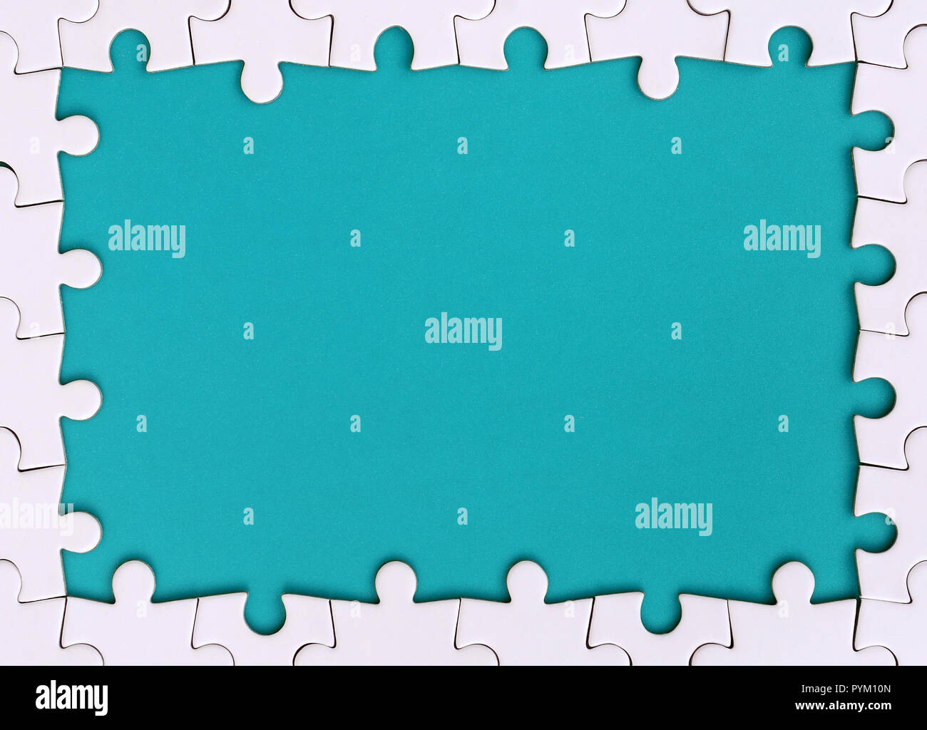 Framing in the form of a rectangle, made of a white jigsaw puzzle ...