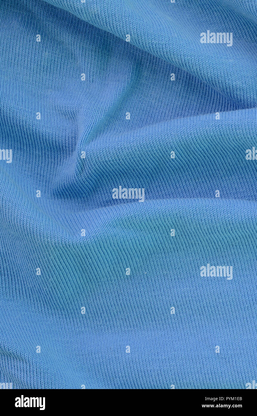 The texture of the fabric in blue color. Material for making shirts and ...