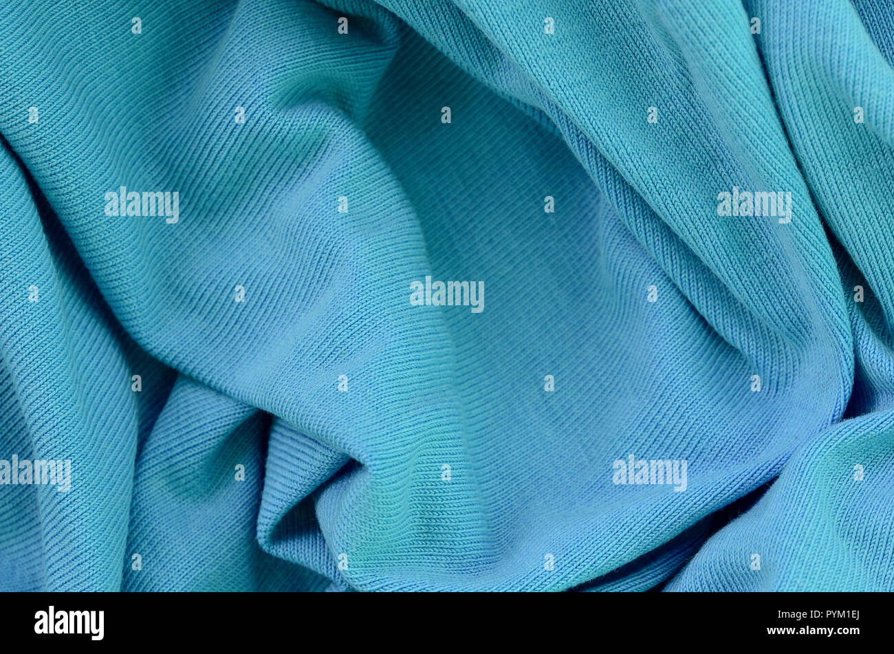 The texture of the fabric in blue color. Material for making shirts and ...