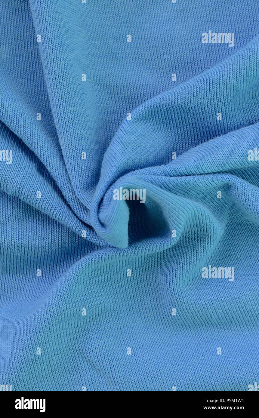 The texture of the fabric in blue color. Material for making shirts and ...