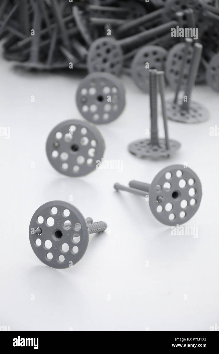 A gray plastic dowel fastening for thermal insulation with round ...