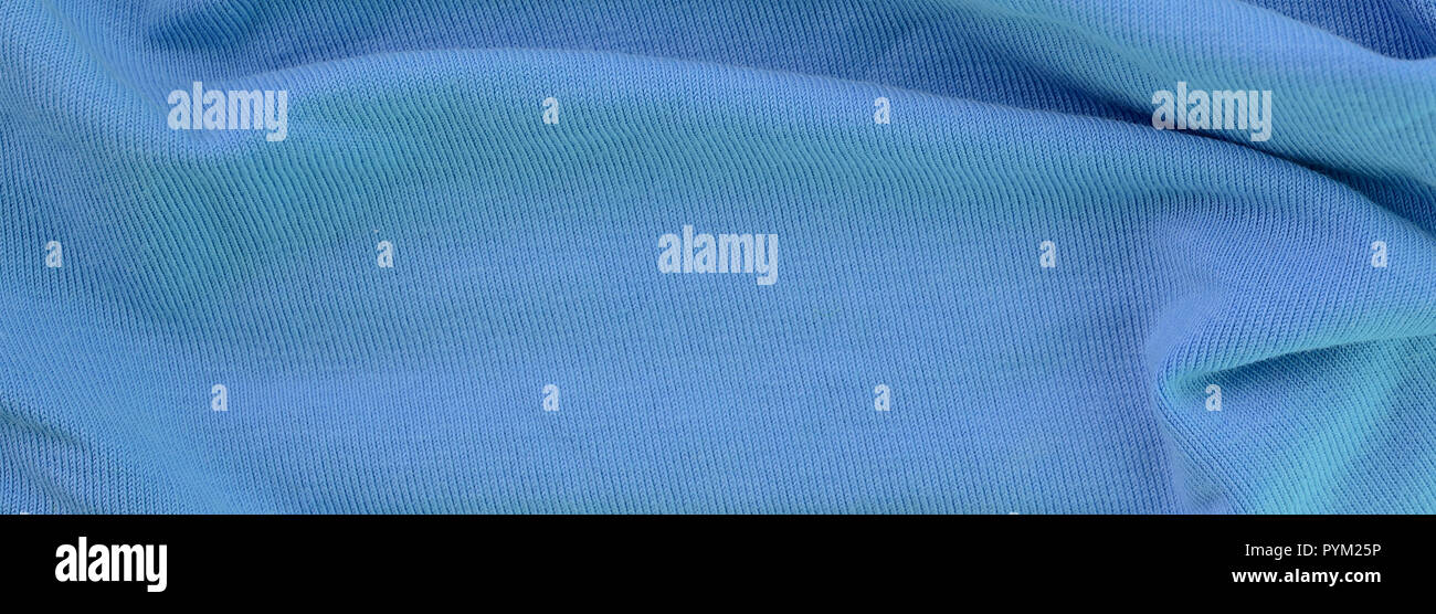 The texture of the fabric in blue color. Material for making shirts and ...