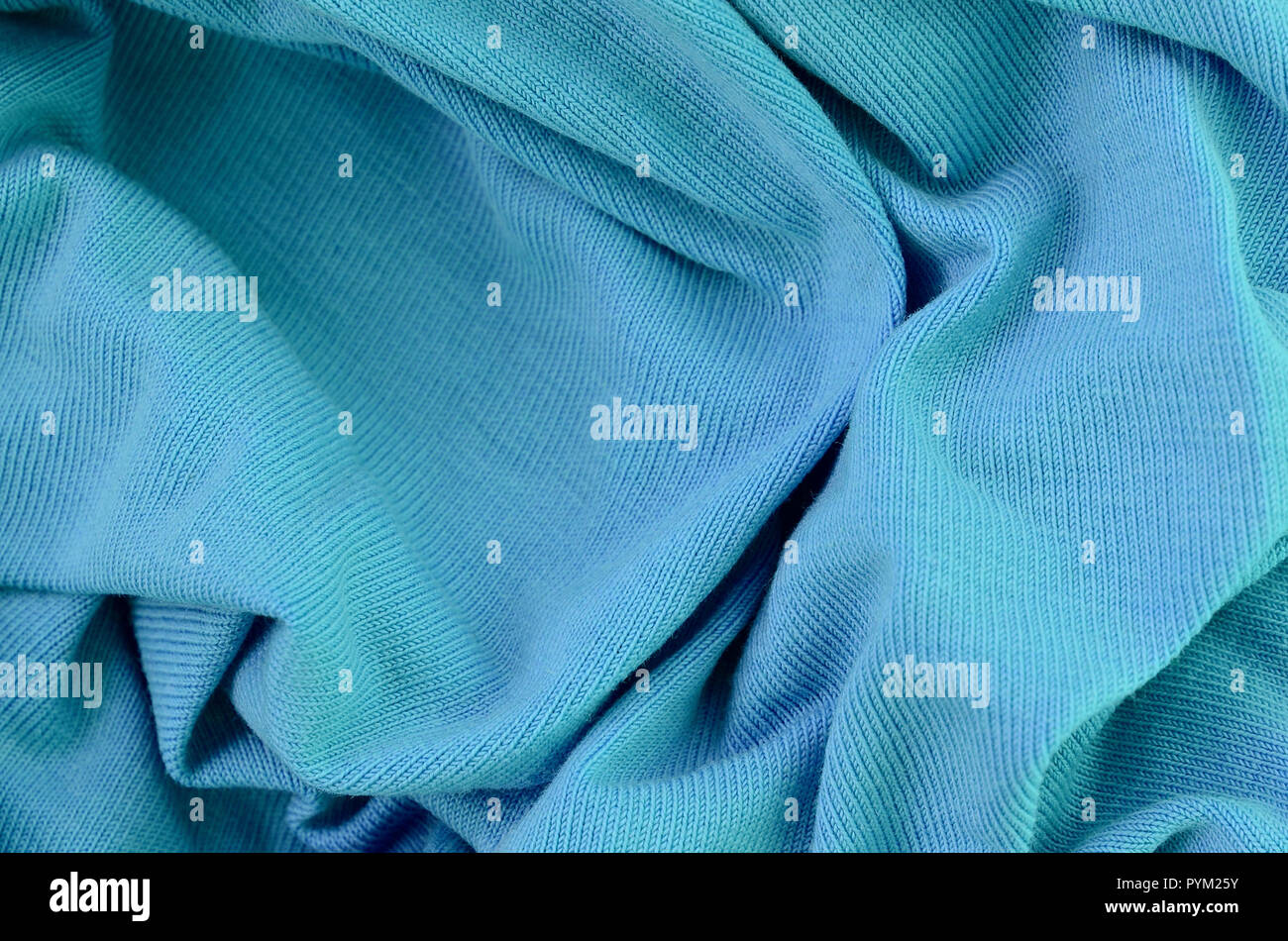 The texture of the fabric in blue color. Material for making shirts and ...