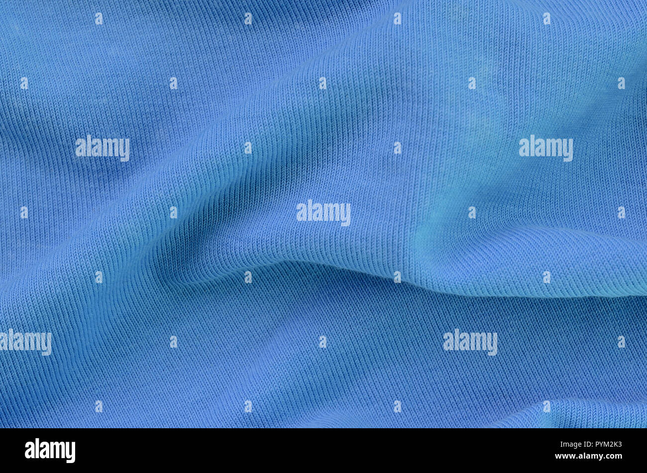 The texture of the fabric in blue color. Material for making shirts and ...