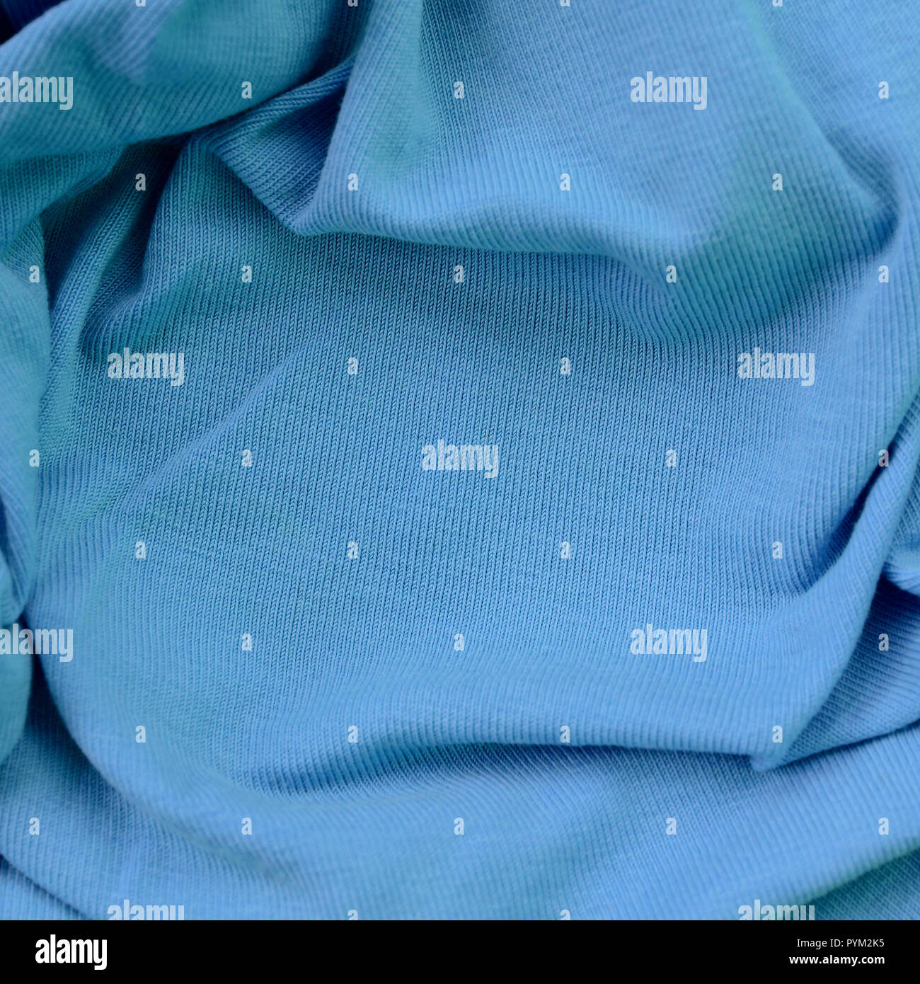 The texture of the fabric in blue color. Material for making shirts and ...