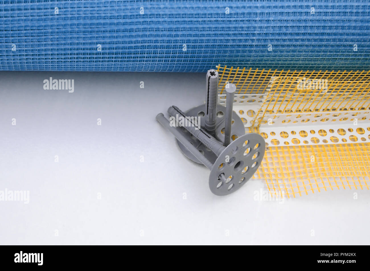 A set of construction items for the insulation of walls. Plastic dowels ...