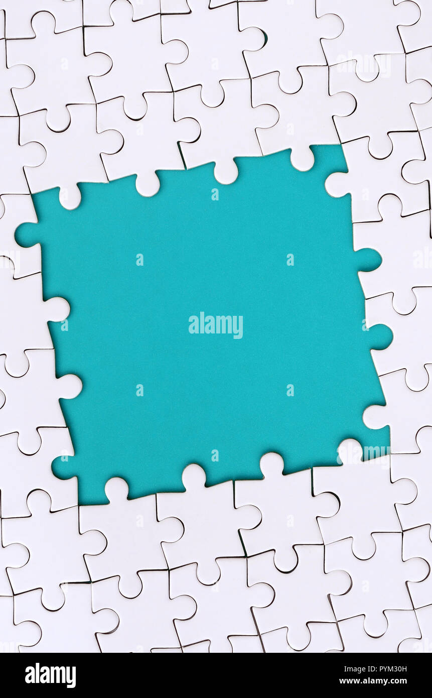 Framing in the form of a rectangle, made of a white jigsaw puzzle ...