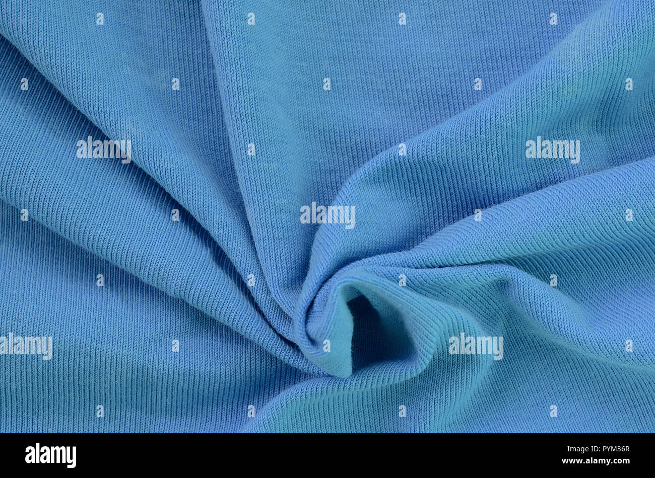 The texture of the fabric in blue color. Material for making shirts and ...