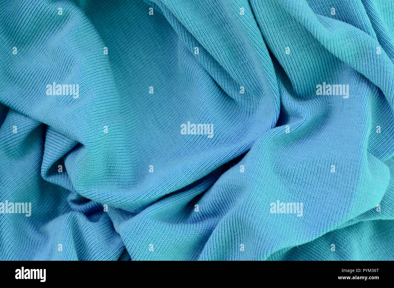 The texture of the fabric in blue color. Material for making shirts and ...