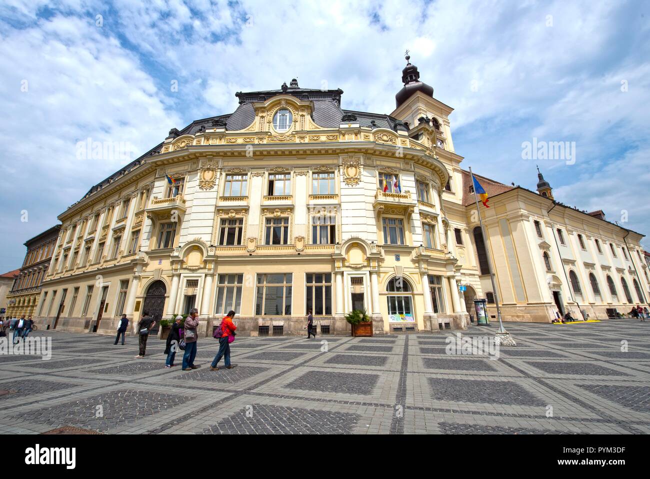 ROMANIA, SIBIU. The baroque town hall dominates the central square ...