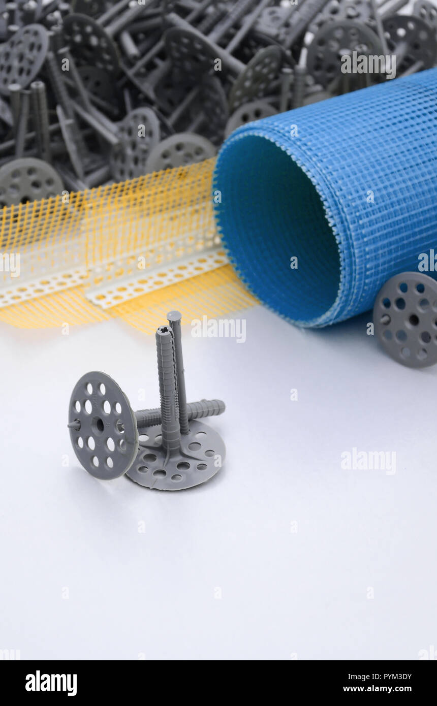 A set of construction items for the insulation of walls. Plastic dowels ...