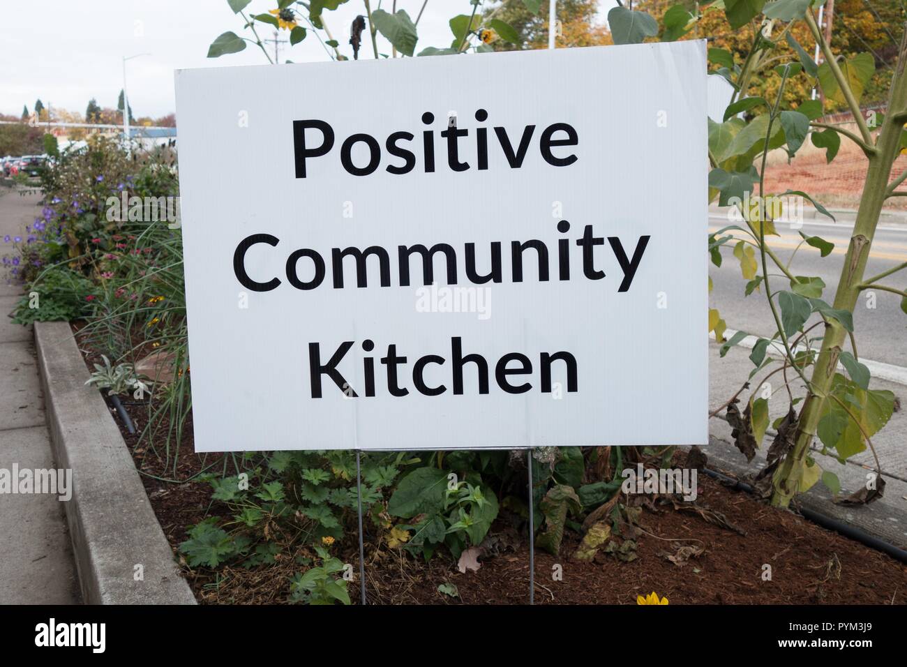 A sign advertising a positive community kitchen in Eugene, OR, USA ...