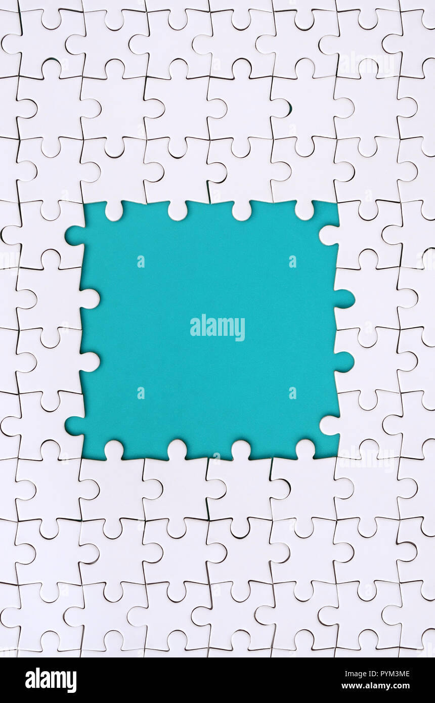 Framing in the form of a rectangle, made of a white jigsaw puzzle ...